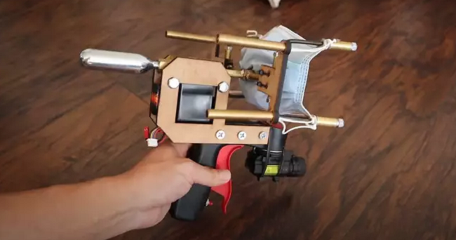 YouTuber Invents 'Face Mask Gun' To Shoot Masks Onto People's Faces