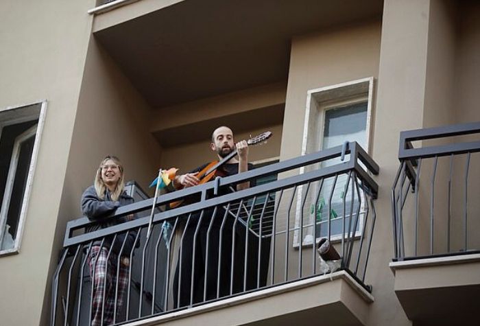 Quarantined Italians Are Dancing & Singing In Balconies