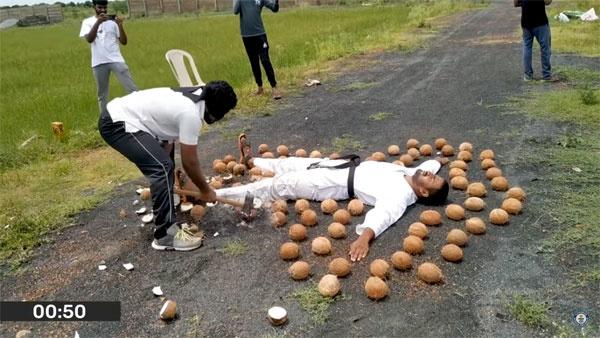 Martial Arts Experts Smash 39 Coconuts While Being Blindfolded