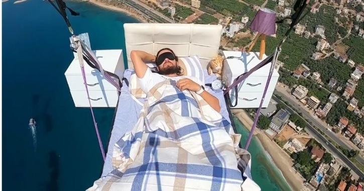 YouTuber Defies Gravity: Paraglides His Bed In The Sky While Taking A Nap