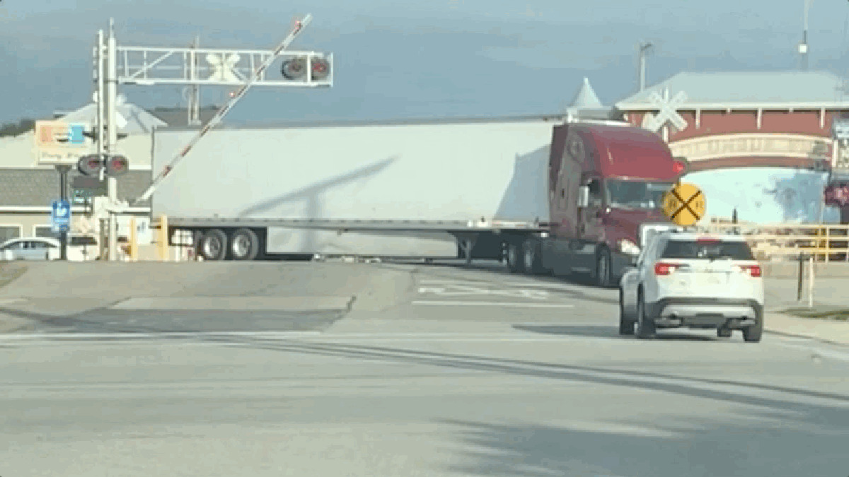 Freight Train Demolishes Semi-truck Caught In Its Path