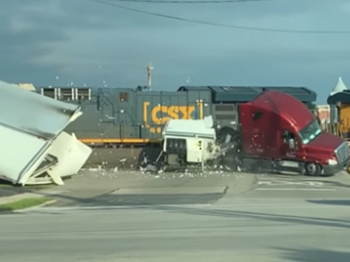 Freight Train Demolishes Semi-truck Caught In Its Path