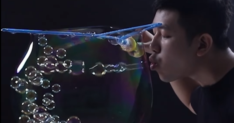Man Sets World Record For Blowing Over 700 Tiny Bubbles Inside A Big Bubble