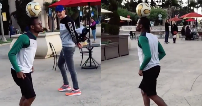 Man Balancing A Football On His Head While Moonwalking