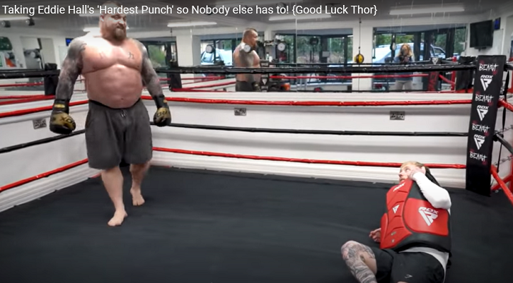 Former Olympian Takes A Punch From The World's Former Strongest Man