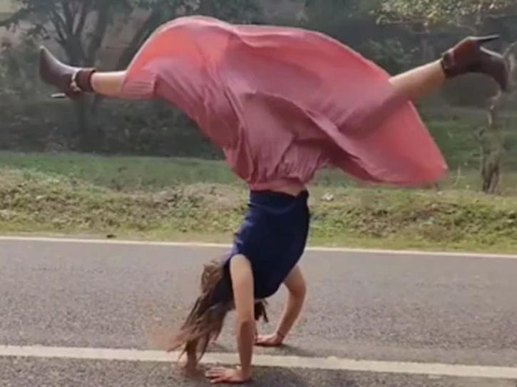 Girl Does Backflip In Skirt And Heels