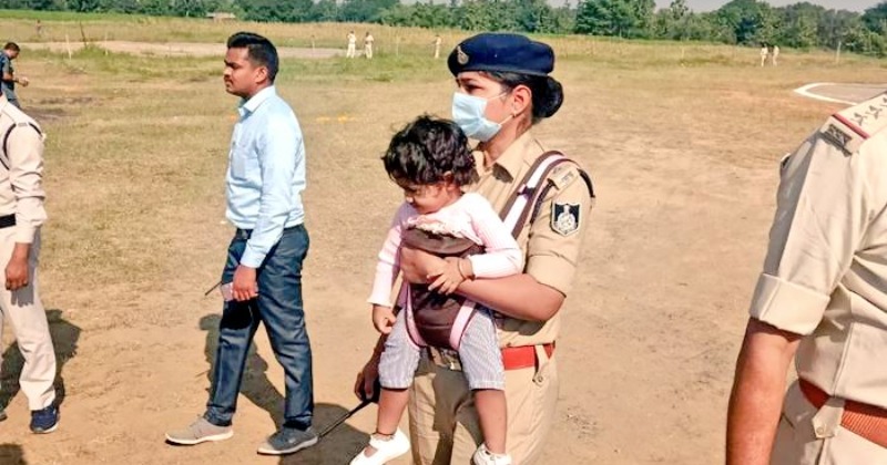 On-Duty Woman Cop Carries Baby To Helipad
