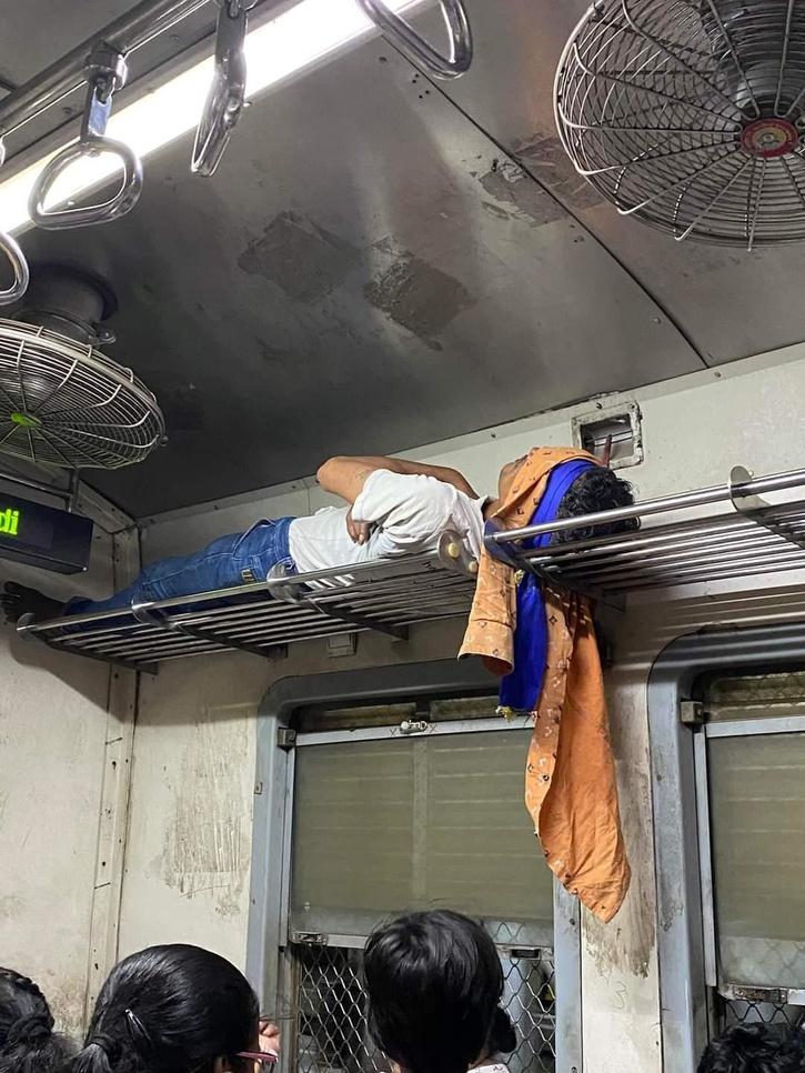 Man Sleeps On Luggage Rack Of Mumbai Local, Is Now Viral