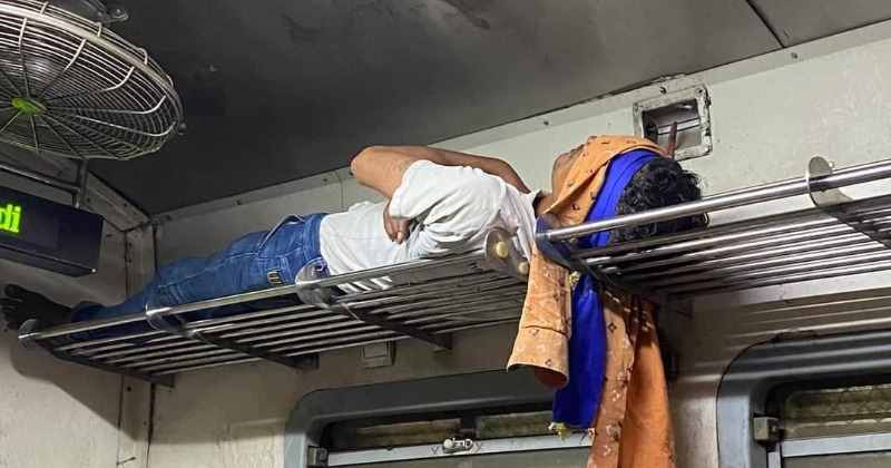 Man Sleeps On Luggage Rack Of Mumbai Local, Is Now Viral