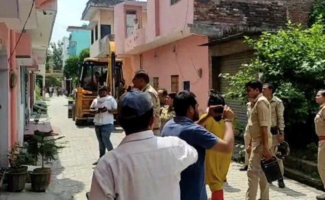 UP Cops Use Bulldozer To Help Woman Return To In-Laws' Home
