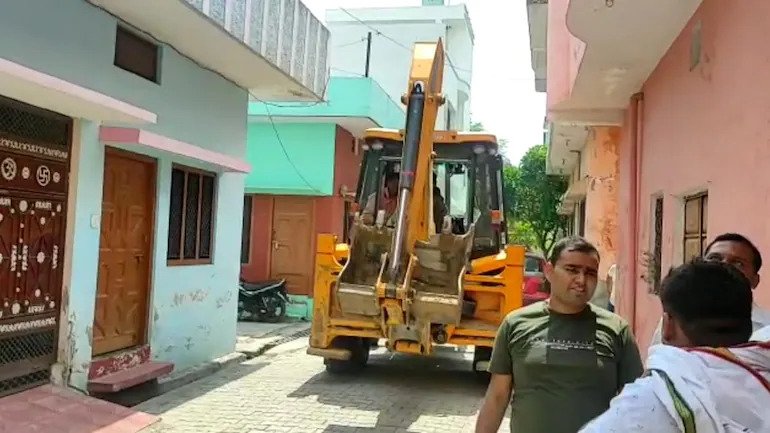 UP Cops Use Bulldozer To Help Woman Return To In-Laws' Home