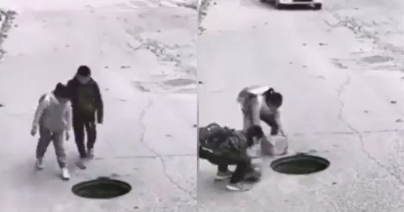Children Cover Open Manhole On The Road