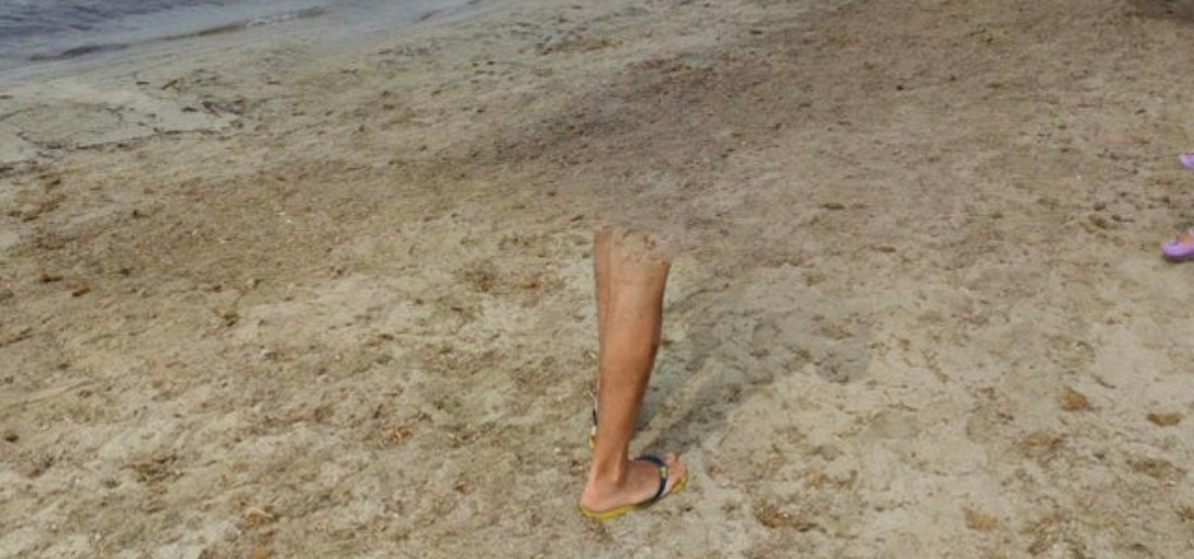 Holiday Photo Shows Just One Foot On Beach