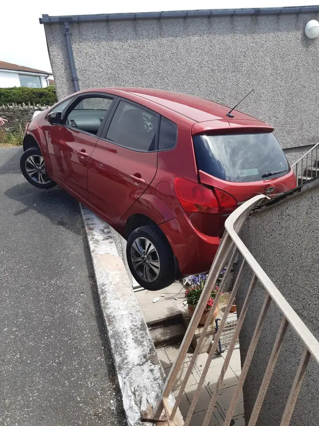 Car Stuck Between Two Buildings After Driver Takes Wrong Turn