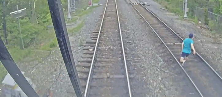 Two Young Boys Almost Avoid Death While Racing On A Railway Track