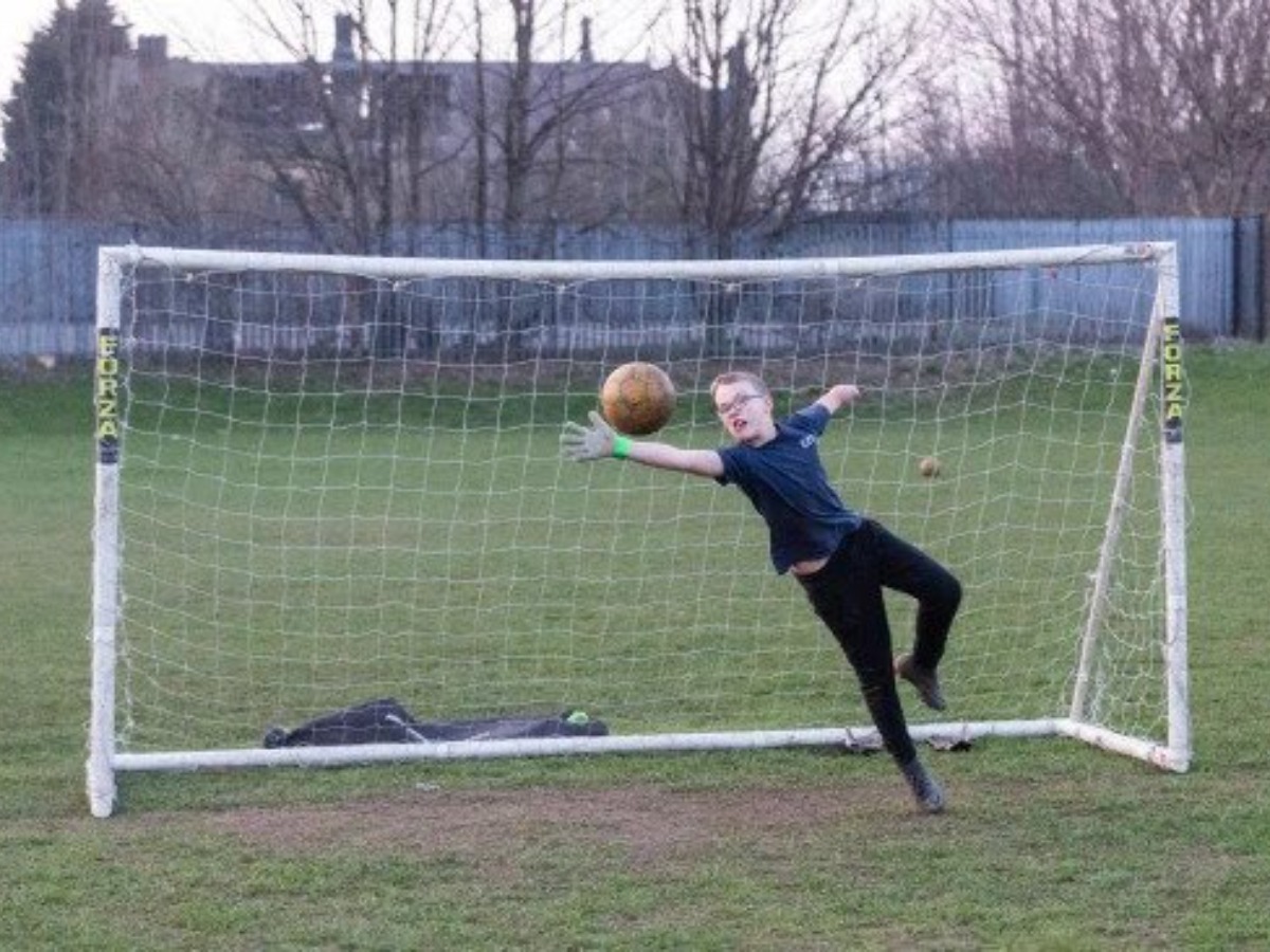 Boy born without forearm becomes star goalkeeper for local football team
