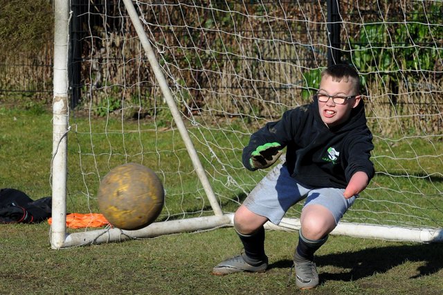 Boy born without forearm becomes star goalkeeper for local football team