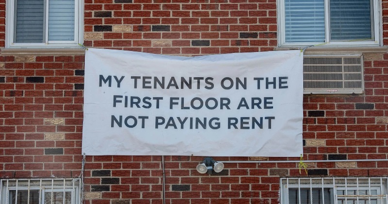 Landlord Posts Giant Signs Calling Out Tenants Who Owe Him Rent Money