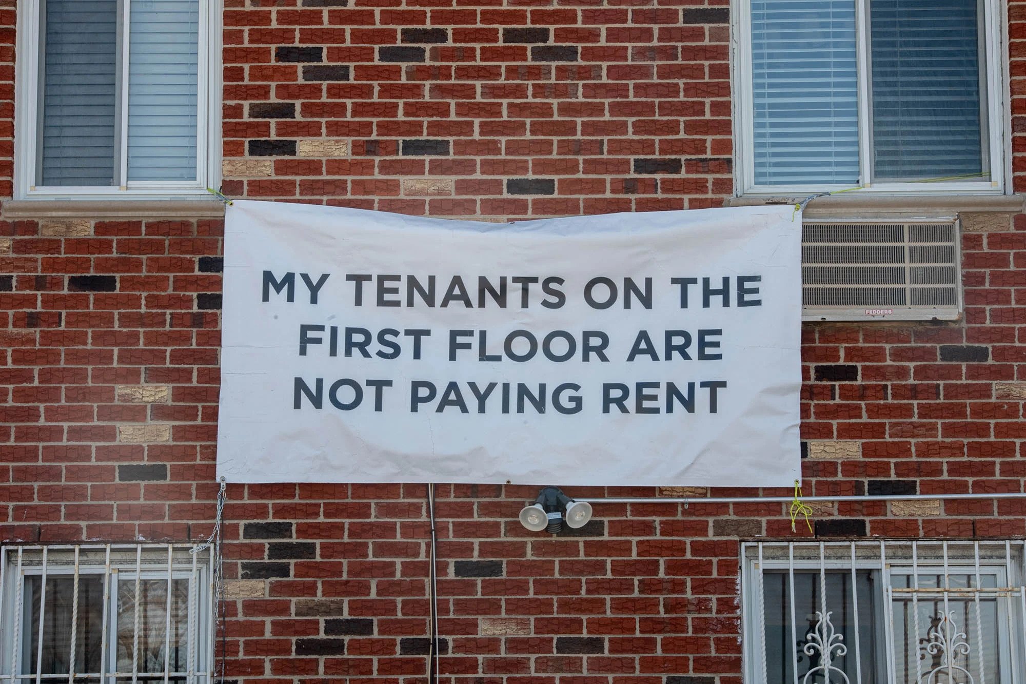 Landlord Posts Giant Signs Calling Out Tenants Who Owe Him Rent Money
