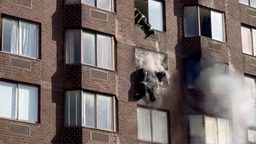 Woman Dangling From 20th-floor Window Rescued By Firefighters