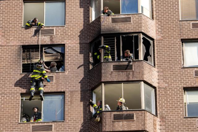 Woman Dangling From 20th-floor Window Rescued By Firefighters