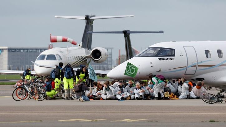 Showing Extreme Courage, Climate Activists Storm Amsterdam Airport To ...