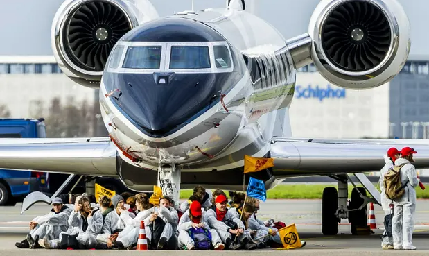 Showing Extreme Courage, Climate Activists Storm Amsterdam Airport To ...