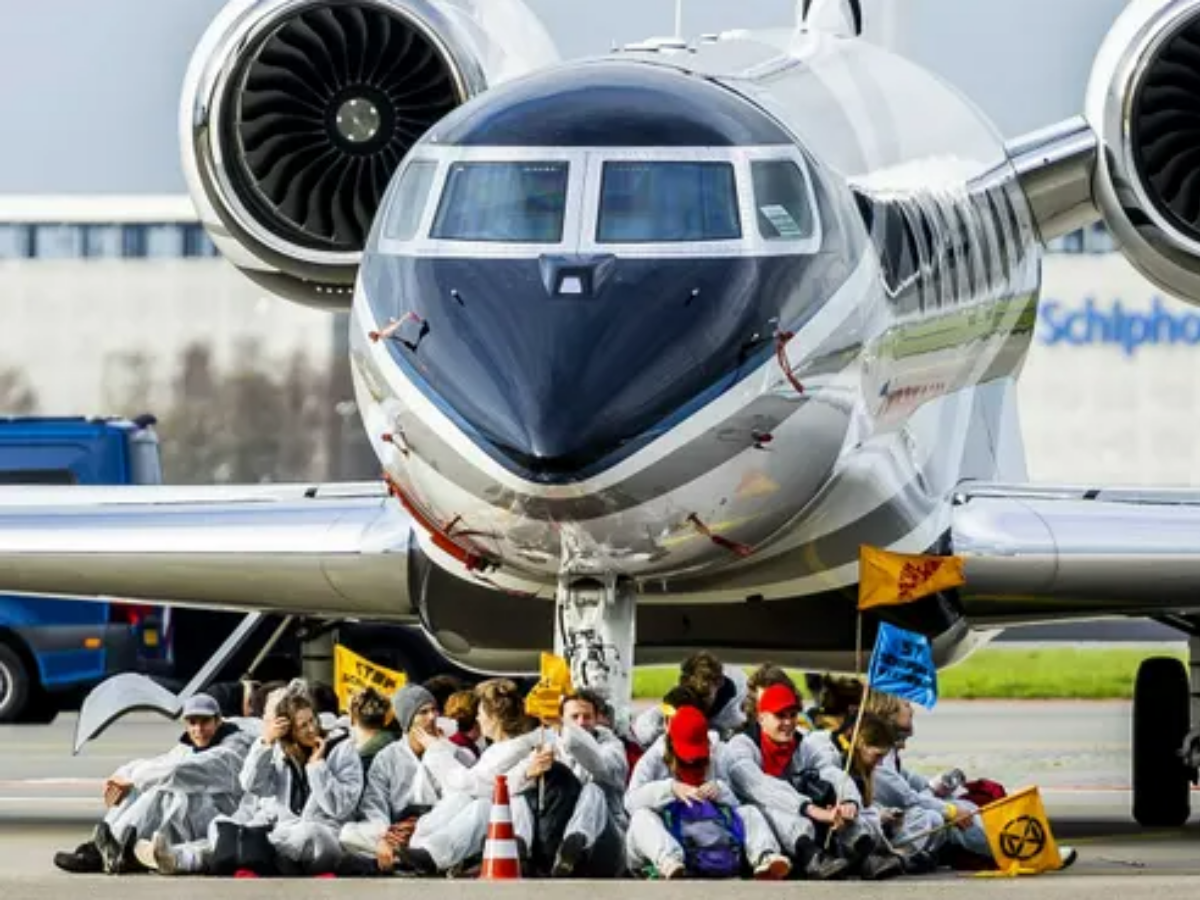 Showing Extreme Courage, Climate Activists Storm Amsterdam Airport To ...