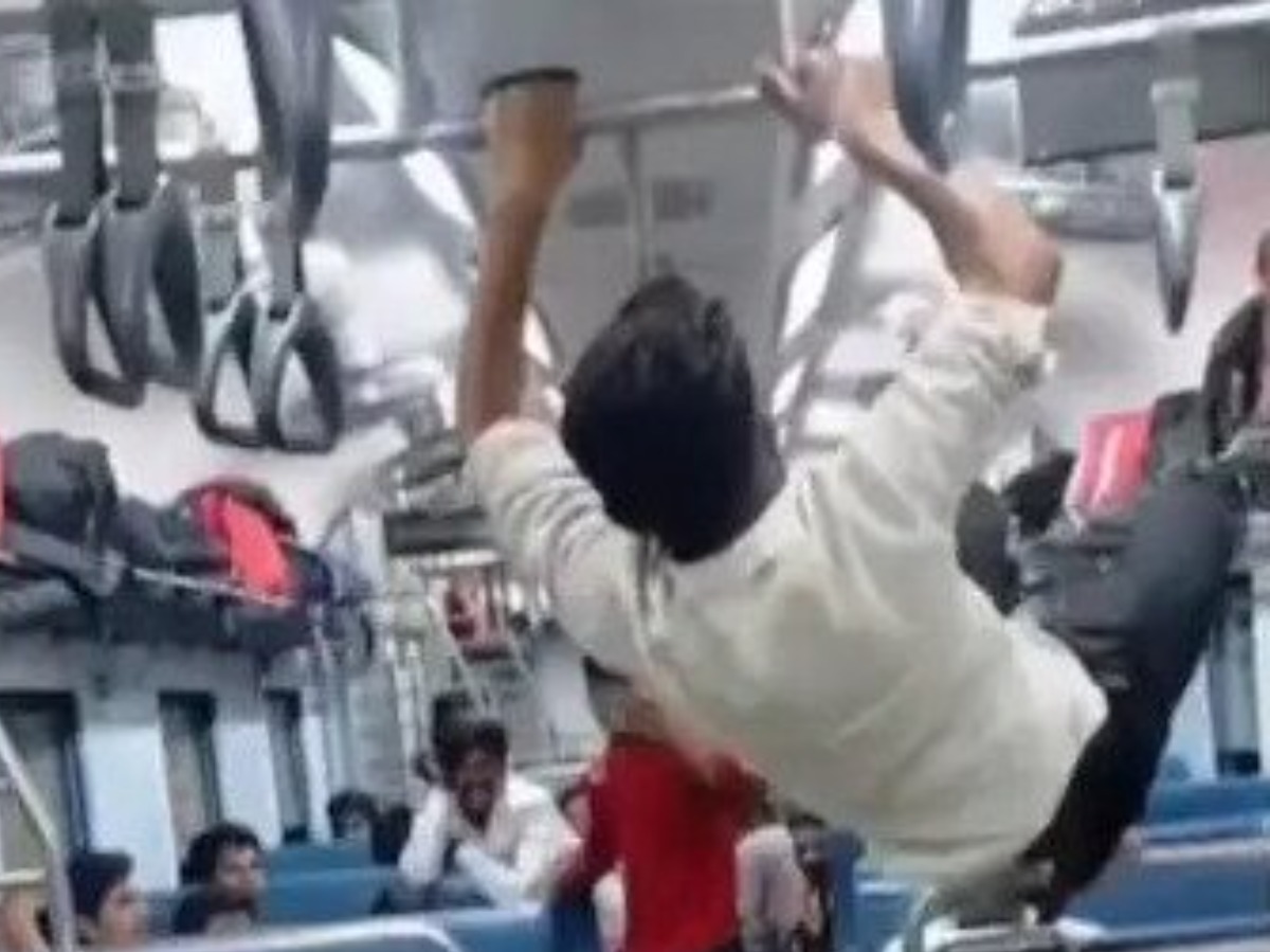 Spiderman! Boy Uses Hand-rests To Swing Across Train Compartment