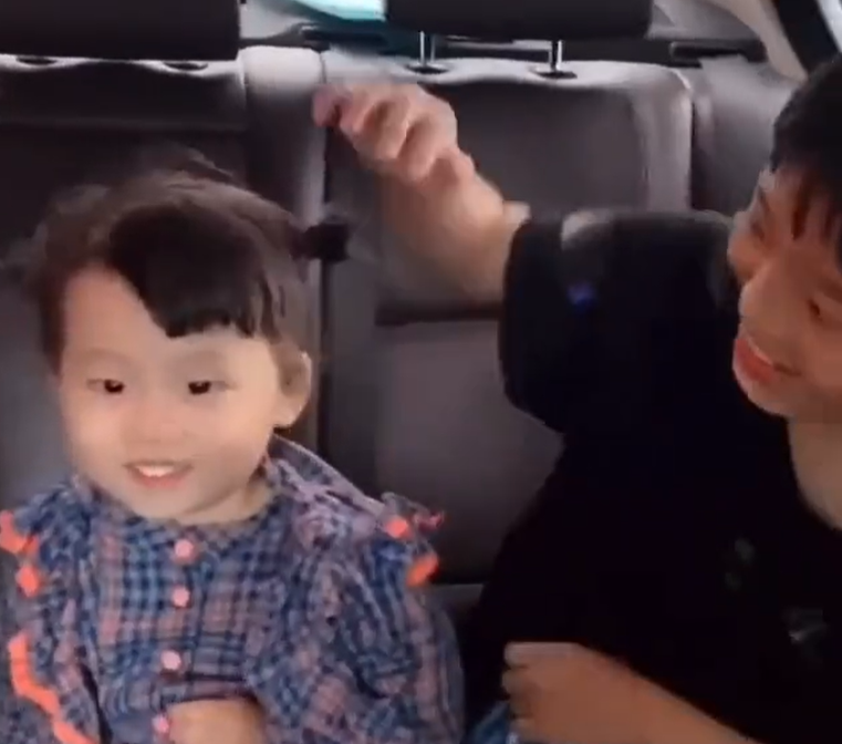 Big Brother Protects Little Sister From Rain In Viral Video