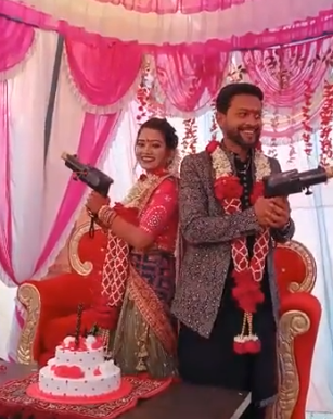 Bride & Groom Pull Off Stunt With Guns At Wedding