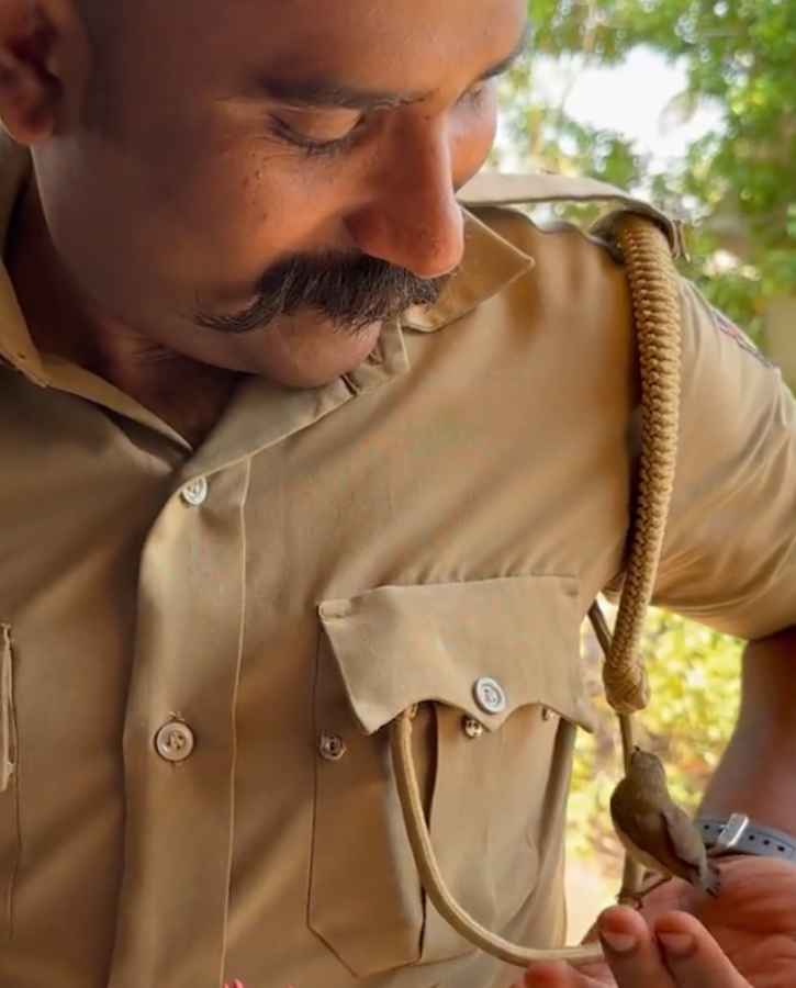 Kerala Police Officer Feeds Bird Perched On His Uniform