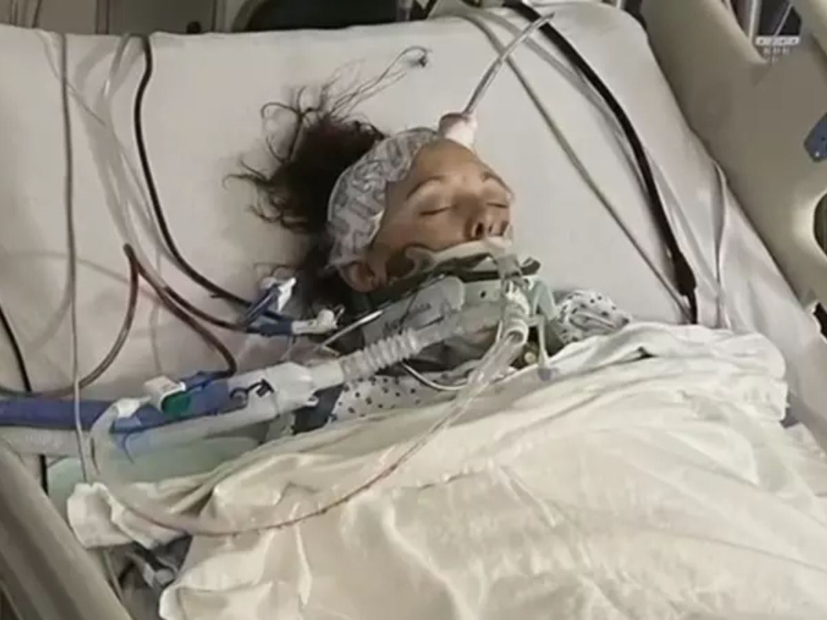 Woman In Hospital Bed On Life Support