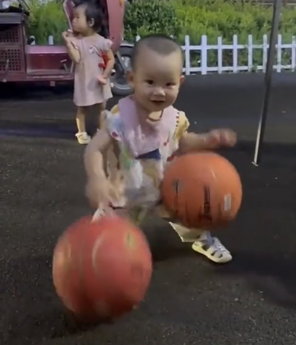 Toddler Dribbles Two Basketball At Once In Viral Video