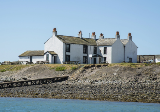 Castle, King, And Cheers: The Allure Of A Tiny UK Island's Regal Retreat