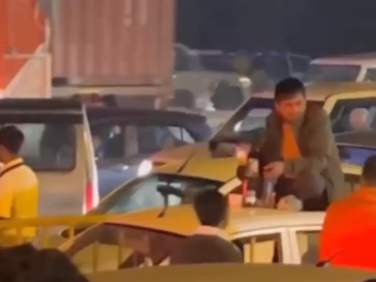 Video: Man Drinks Alcohol On Car's Roof Video: Man Drinks Alcohol On Car's Roof
