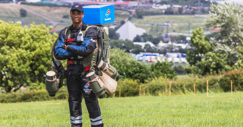 Delivery Agent Flying On A Jetpack To Deliver Pizza