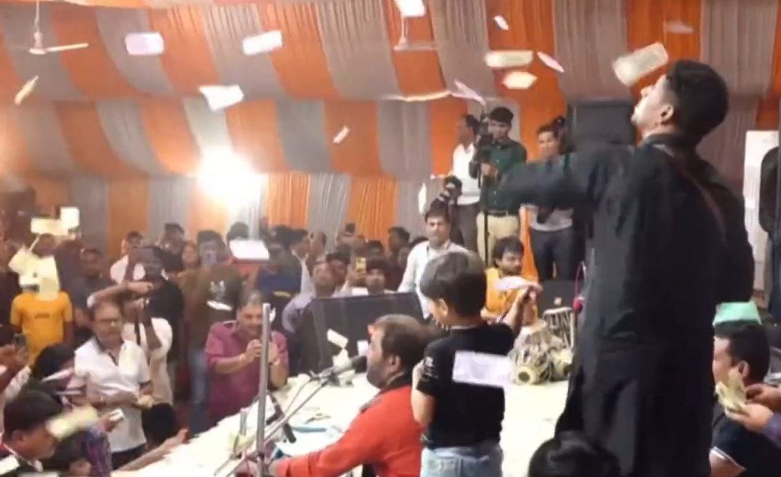 Gujarati Folk Singer Gets Rain On With Cash, Gold And Silver Coins