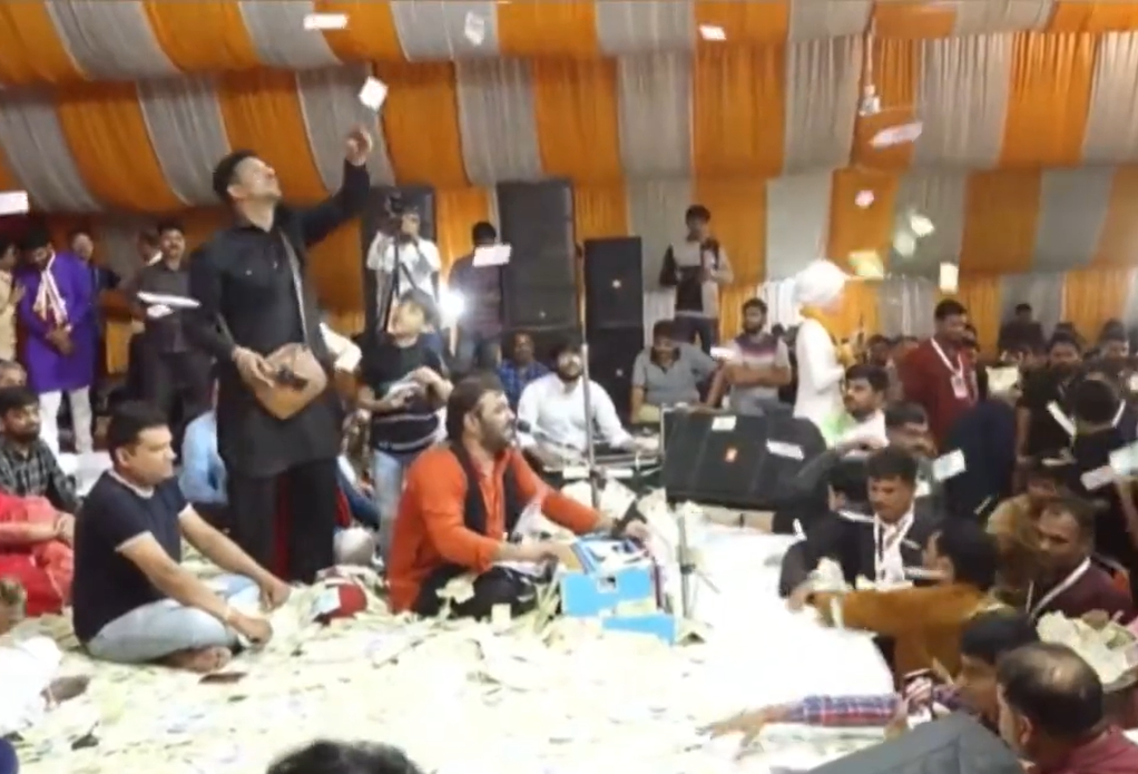 Gujarati Folk Singer Gets Rain On With Cash, Gold And Silver Coins