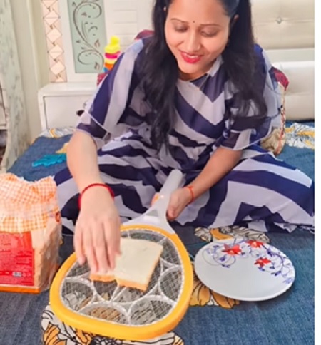 Woman Toasts Bread On Mosquito Racket To Make 'Macchar Toast'